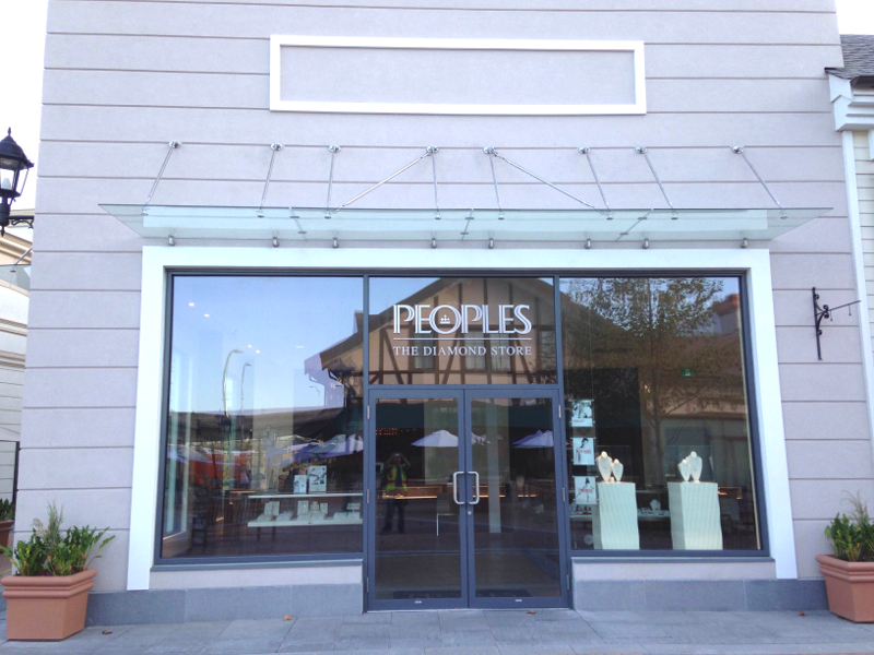 Glass canopy system by Angel Glass. Custom glass canopy and metals.